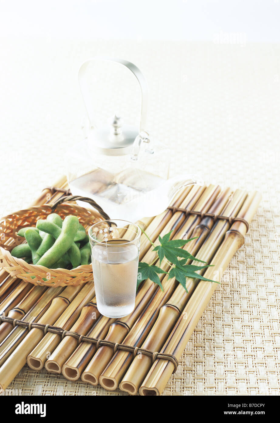 Cold sake and boiled soybeans Stock Photo - Alamy