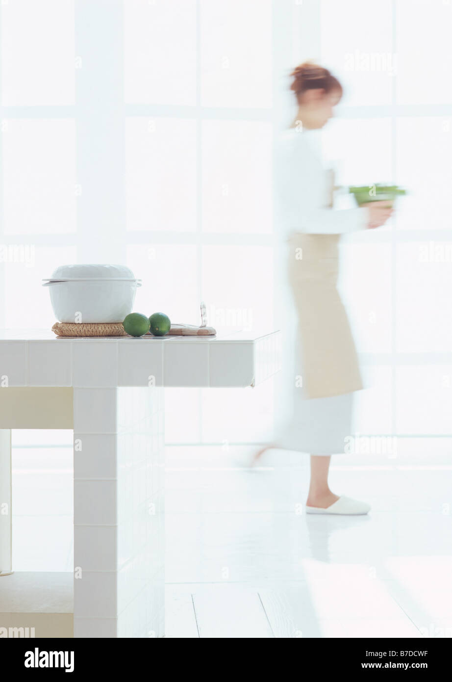 Woman in kitchen Stock Photo - Alamy