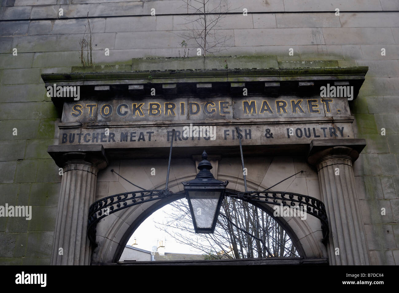 Stone archway indicating a local market Stock Photo - Alamy