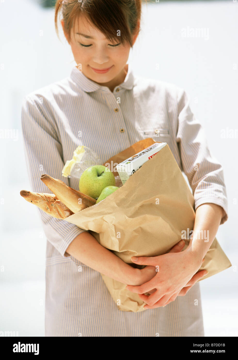 Woman holding grocery bag Stock Photo - Alamy Woman holding grocery bag Stock Photo - Alamy