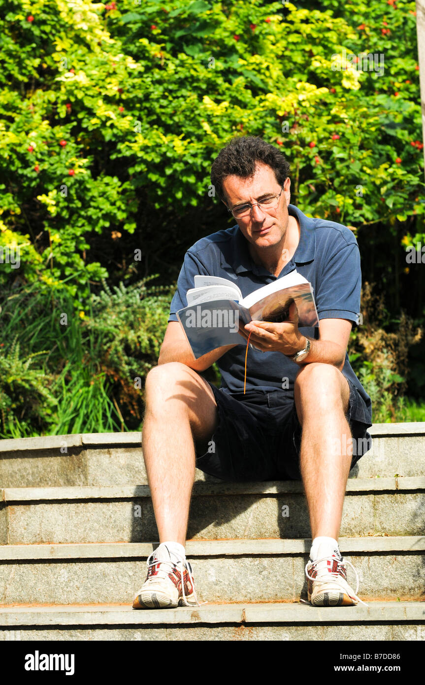 outdoor portrait of man reading Stock Photo - Alamy