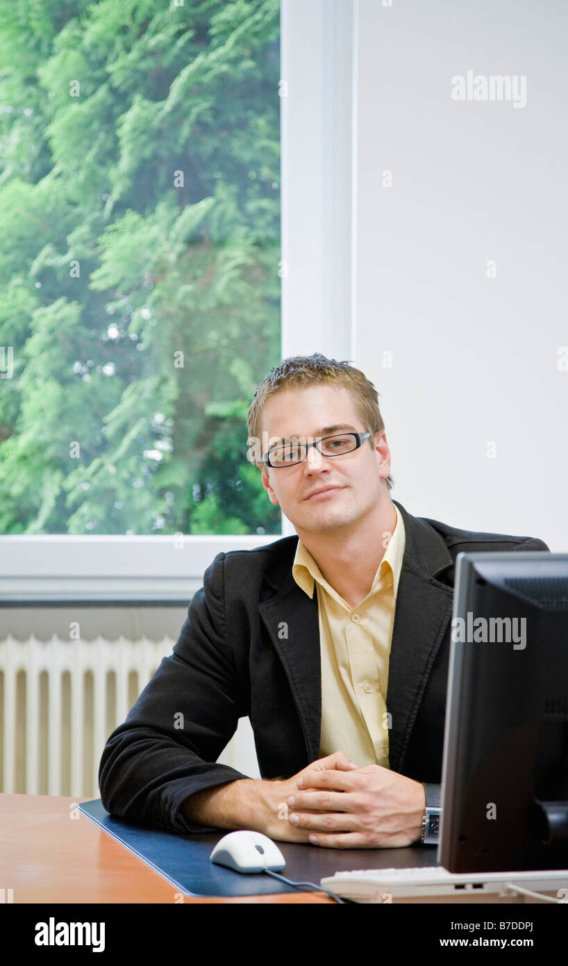 Portrait of man on computer in office Stock Photo - Alamy