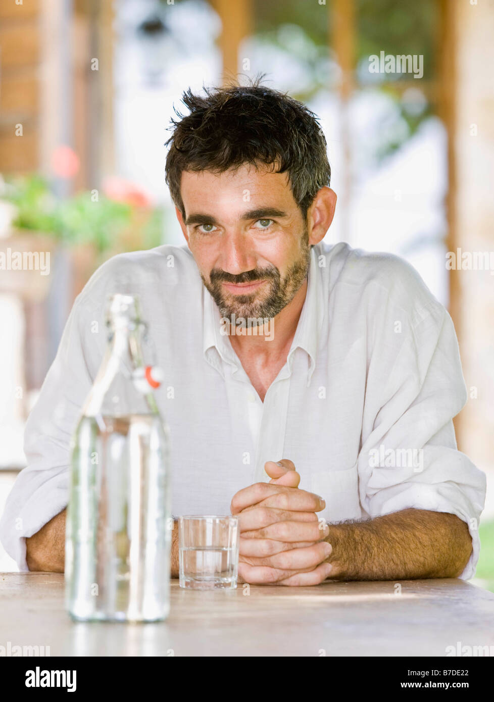 Portrait of man relaxing in a garden Stock Photo - Alamy