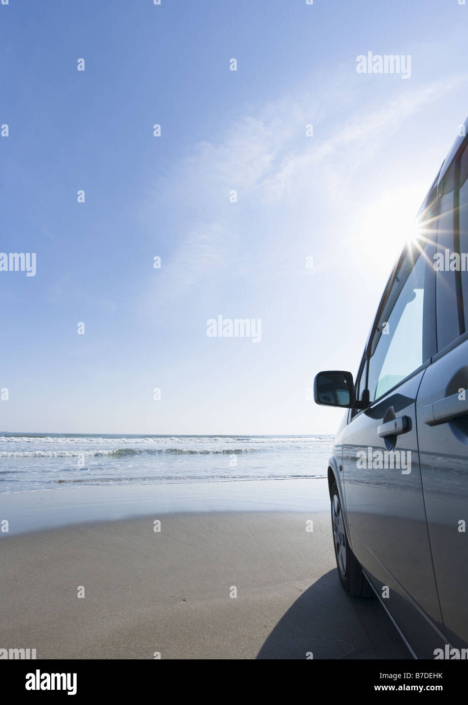 Car on a sandy beach Stock Photo - Alamy