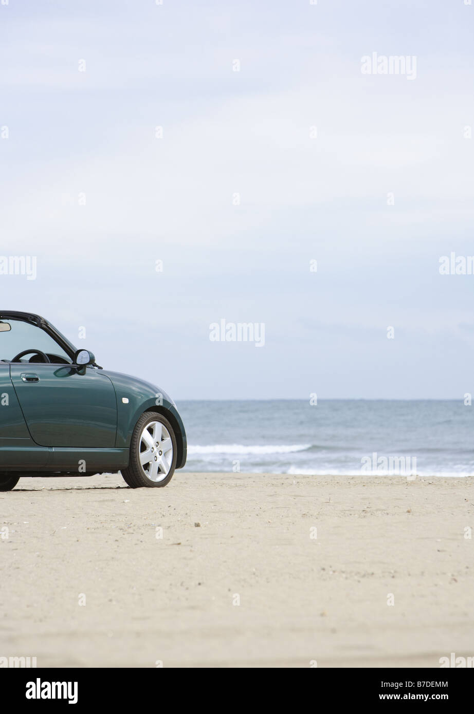 Convertible on a sandy beach Stock Photo - Alamy
