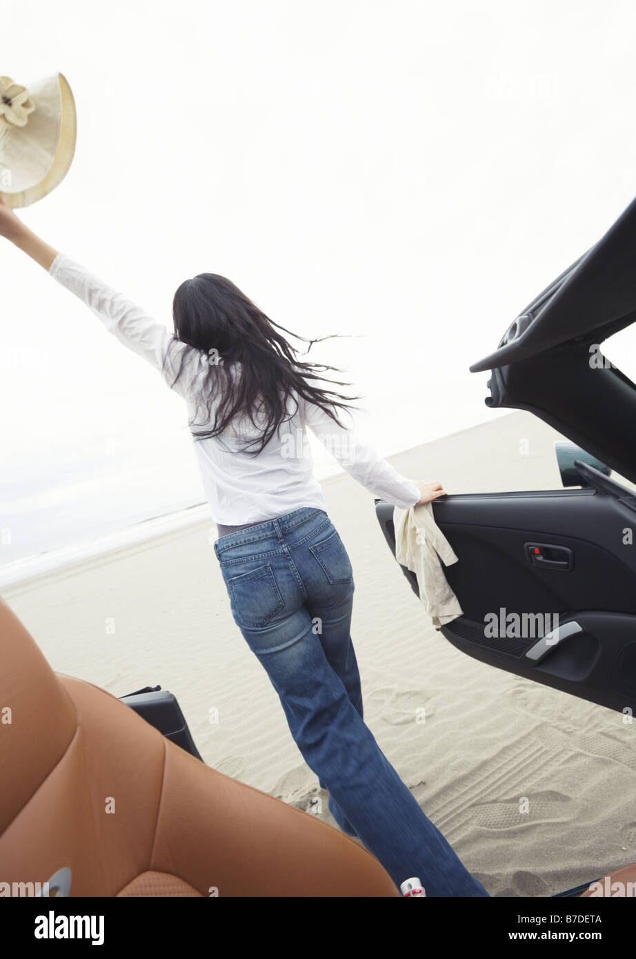 Woman leaving door rear view hi-res stock photography and images - Alamy