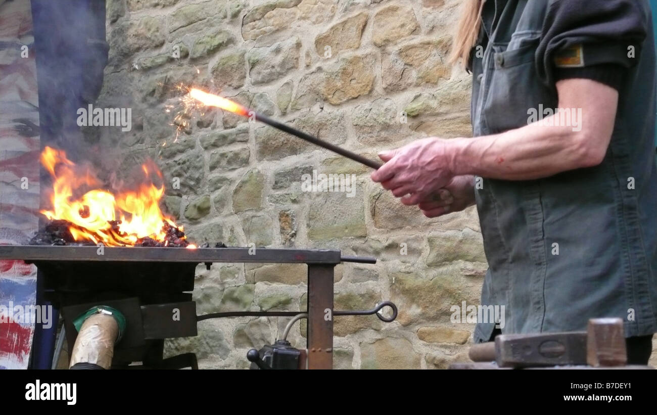 traditional handcraft, smith at work, strike while the iron is hot ...
