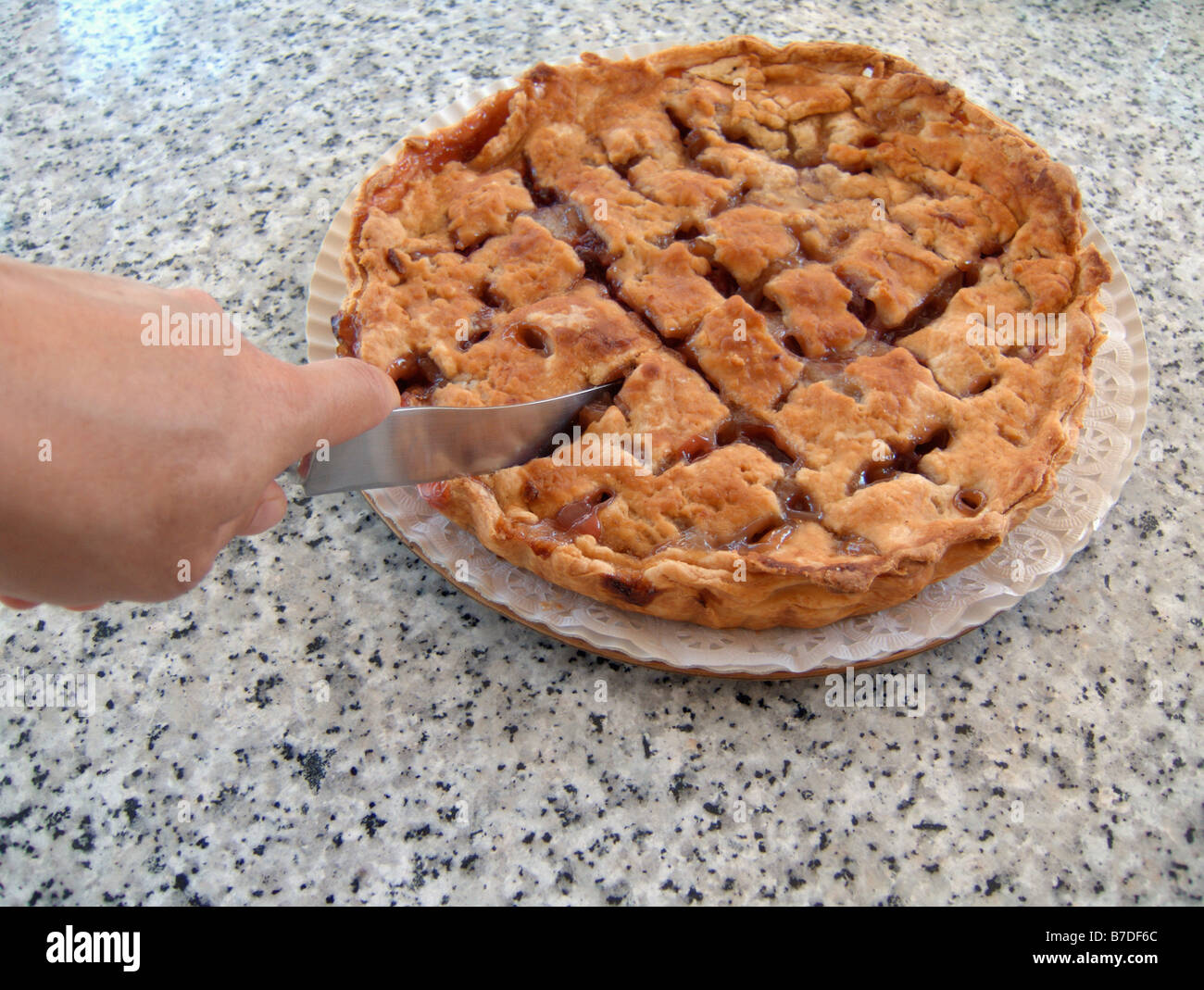 Cutting an apple pie slice Stock Photo - Alamy