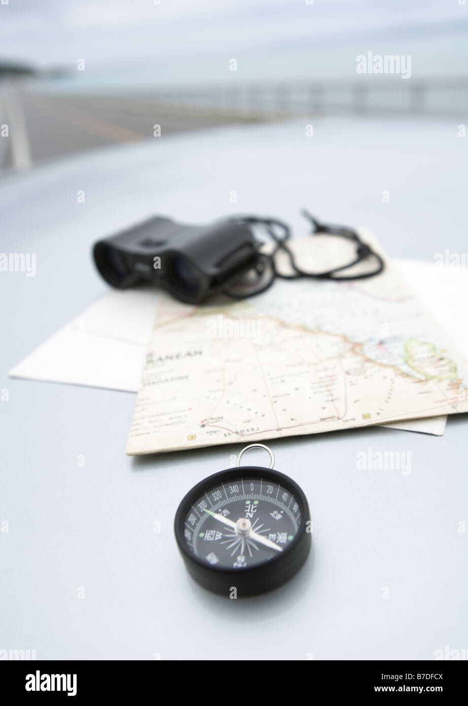 Compass and map Stock Photo - Alamy