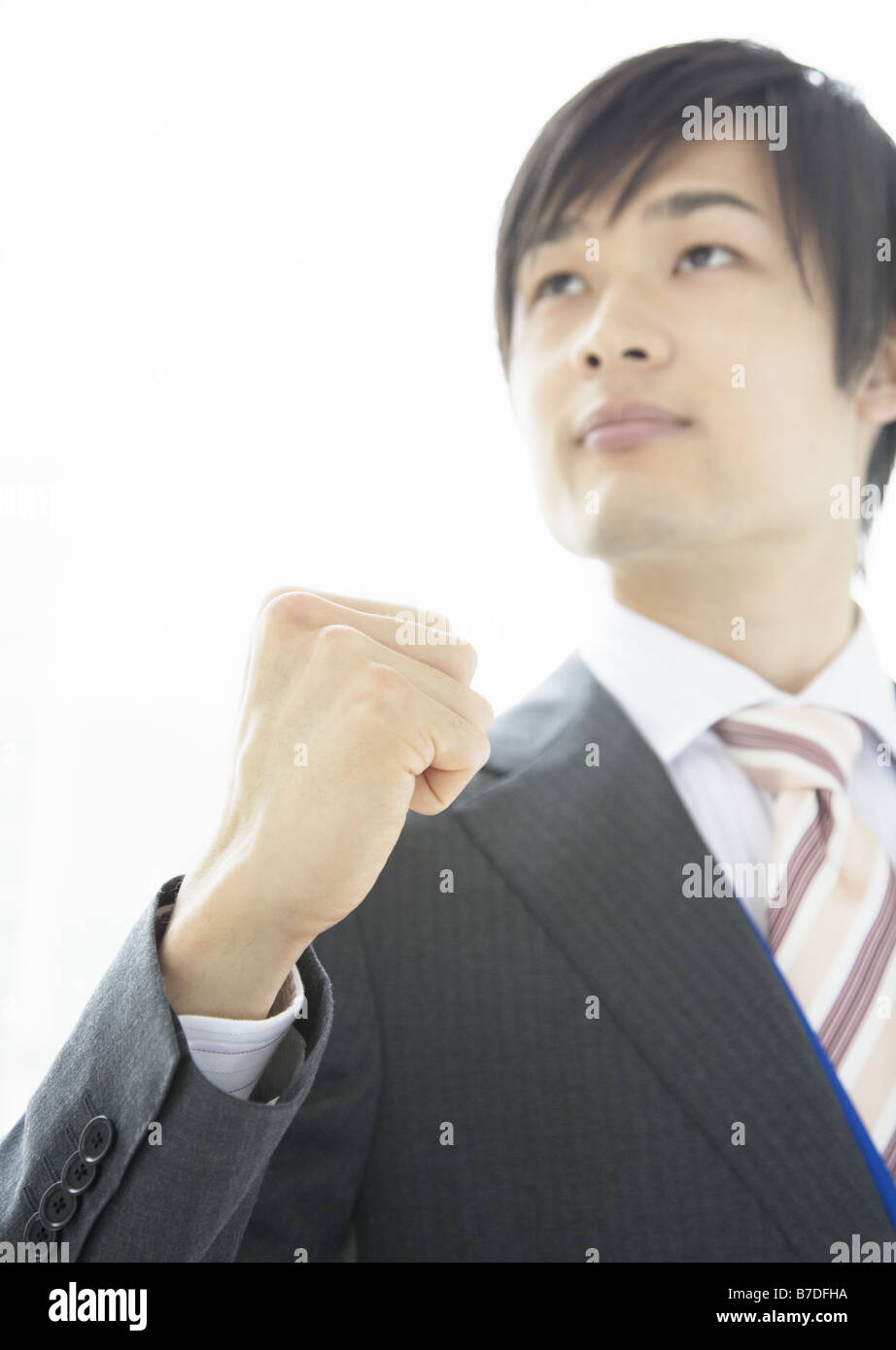 Businessman with victory pose Stock Photo - Alamy