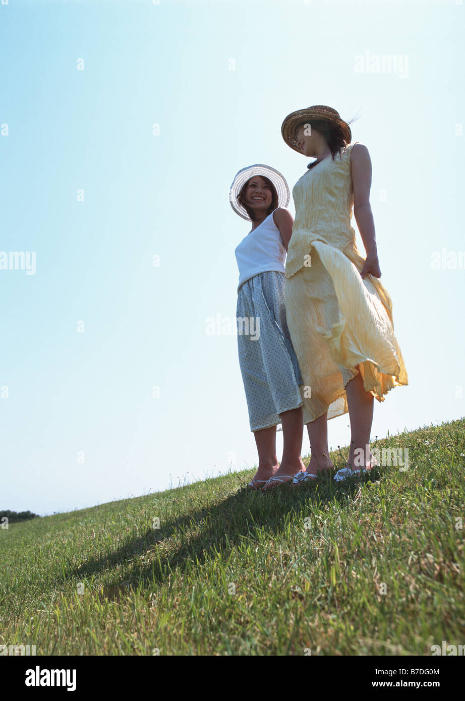 Women standing in field Stock Photo - Alamy