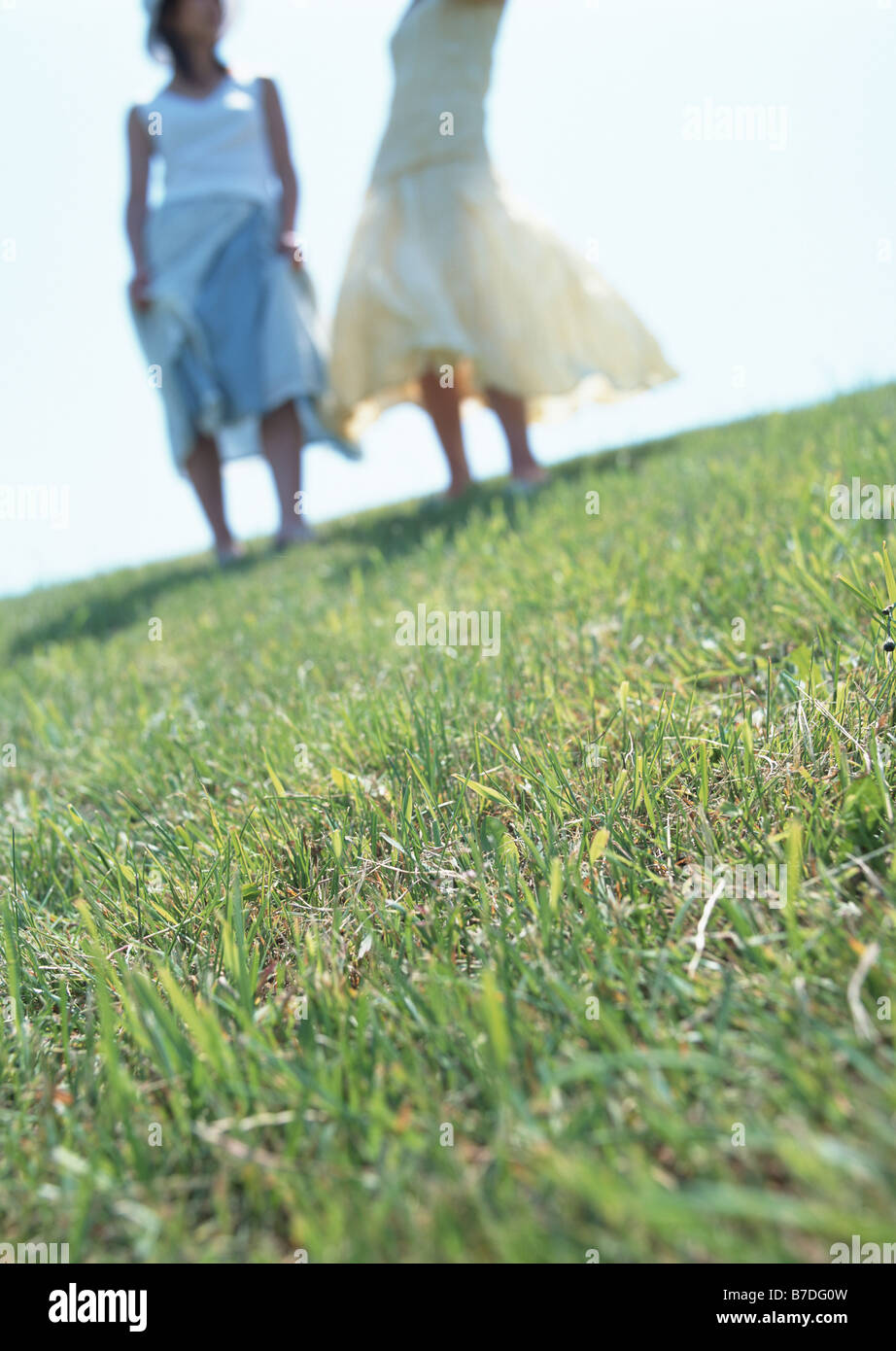 Women standing in field Stock Photo - Alamy