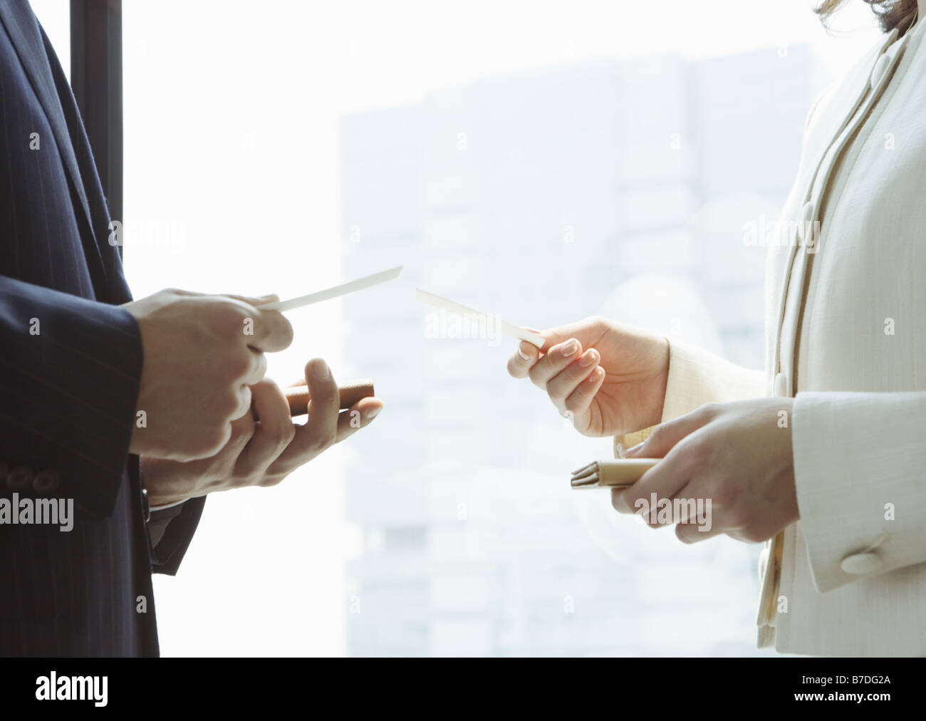 Exchanging business cards Stock Photo - Alamy