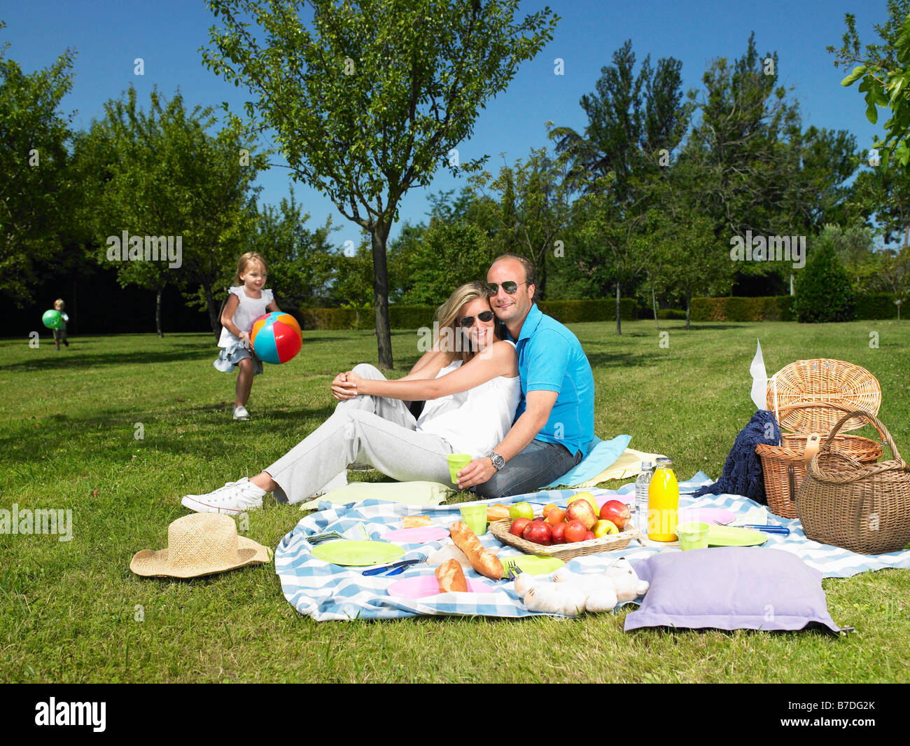 Family having a picnic in the garden Stock Photo - Alamy