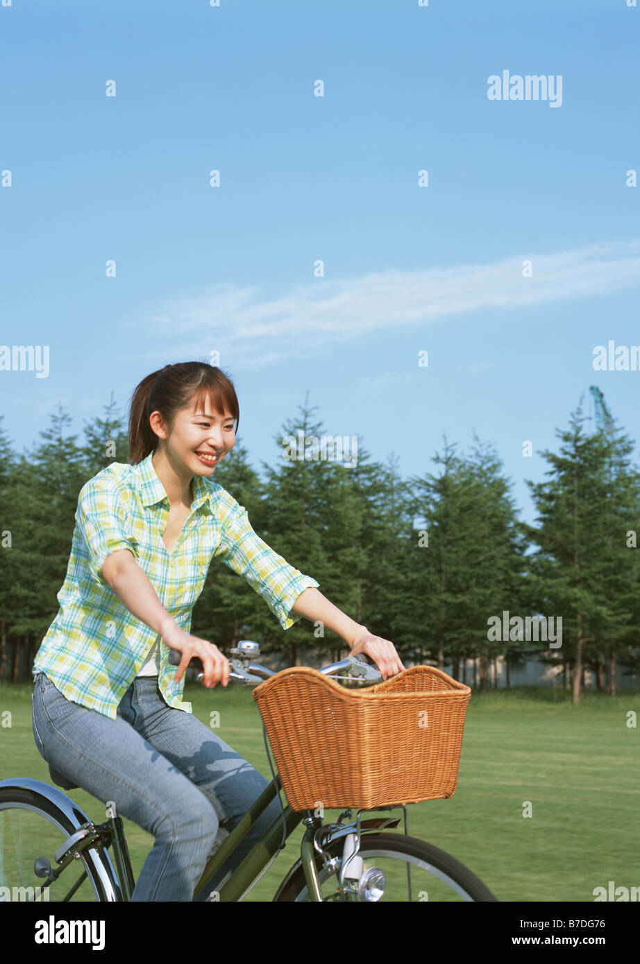 Woman riding a bike Stock Photo - Alamy