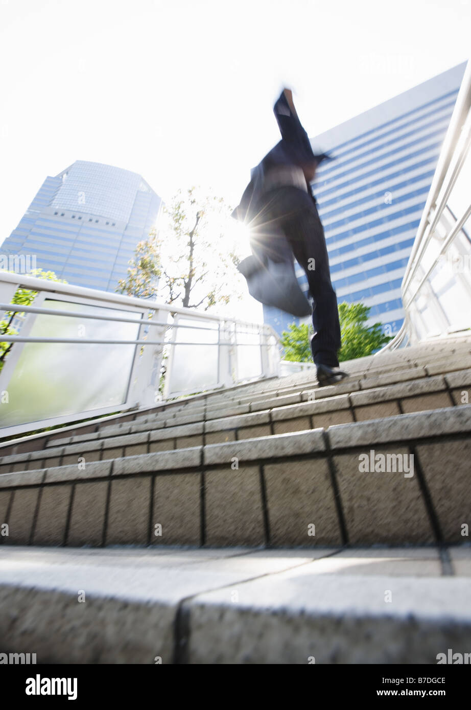 Businessman running up stairs hi-res stock photography and images - Alamy