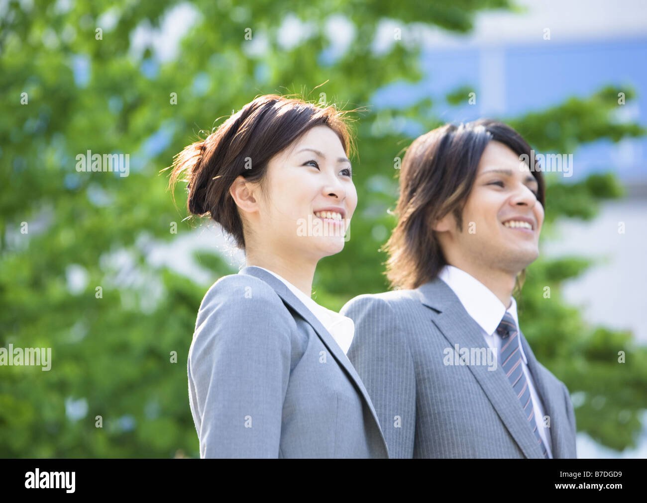 Office workers looking up Stock Photo - Alamy