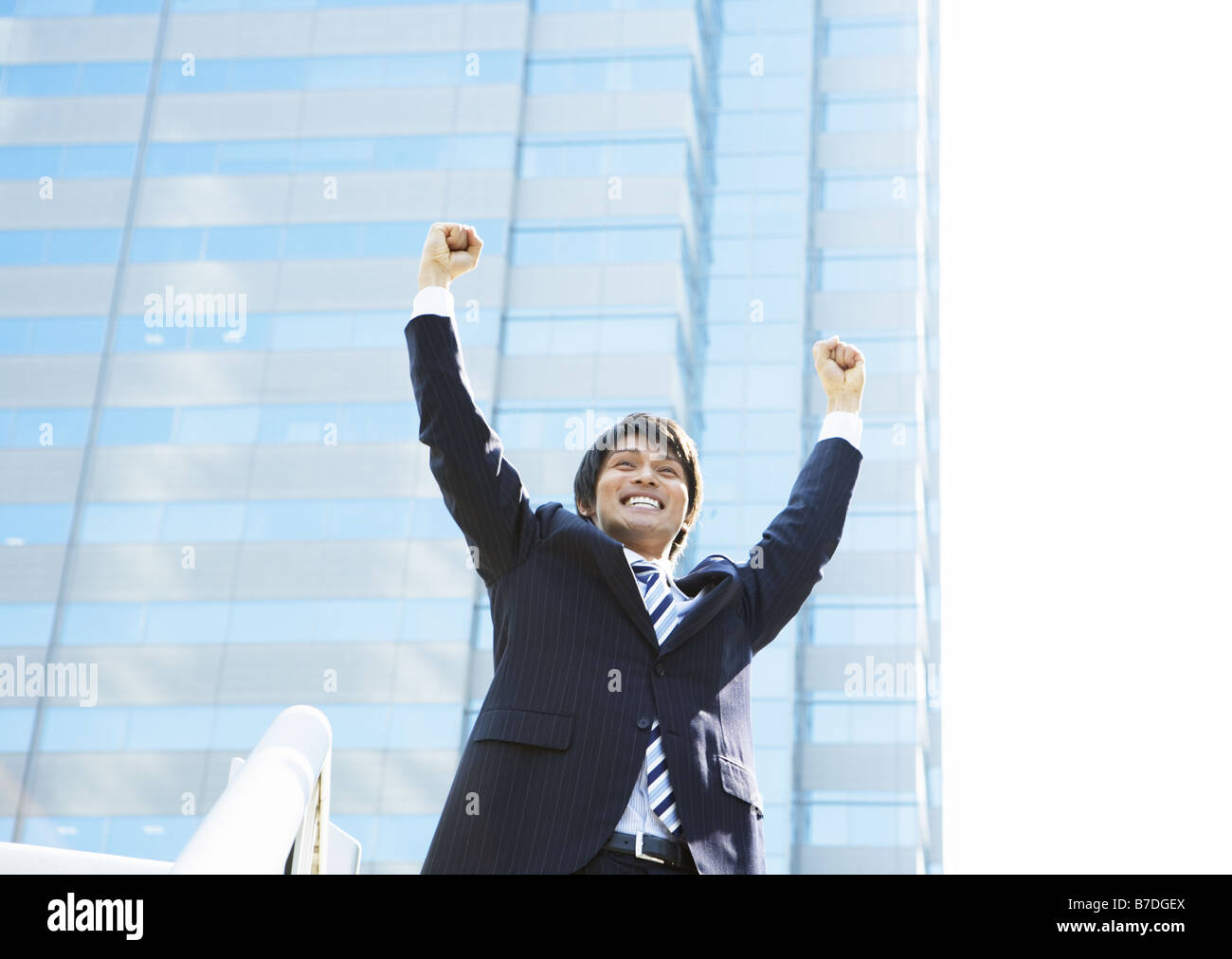Businessman with victory pose Stock Photo - Alamy