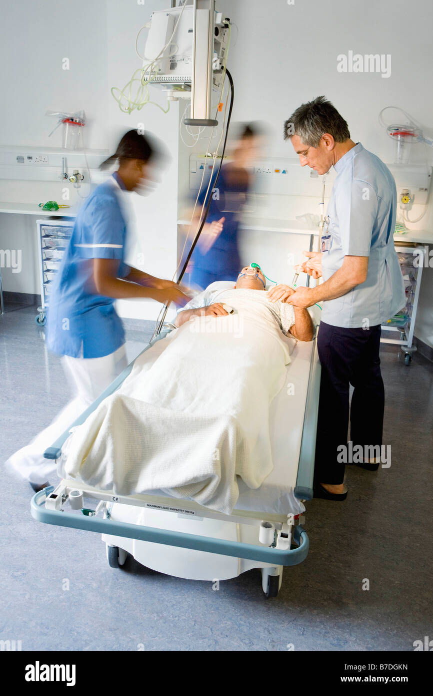 A doctor helping a patient in hospital Stock Photo - Alamy