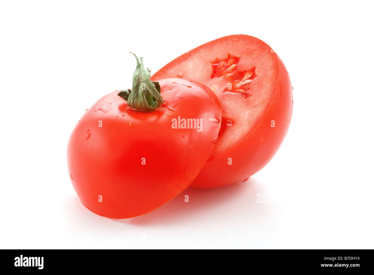 Tomato cut on two half Stock Photo - Alamy