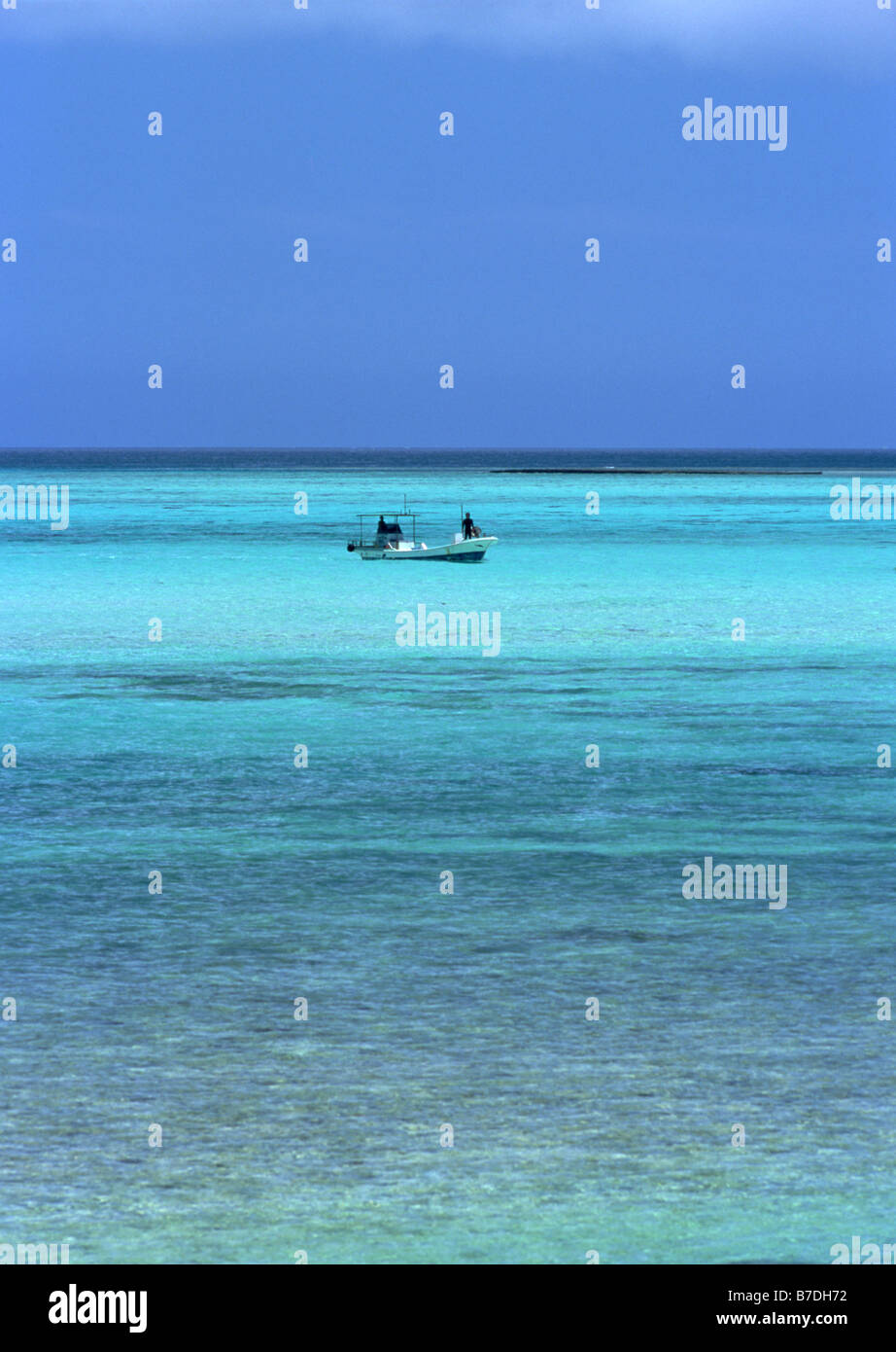 A boat in shallow beach Stock Photo - Alamy