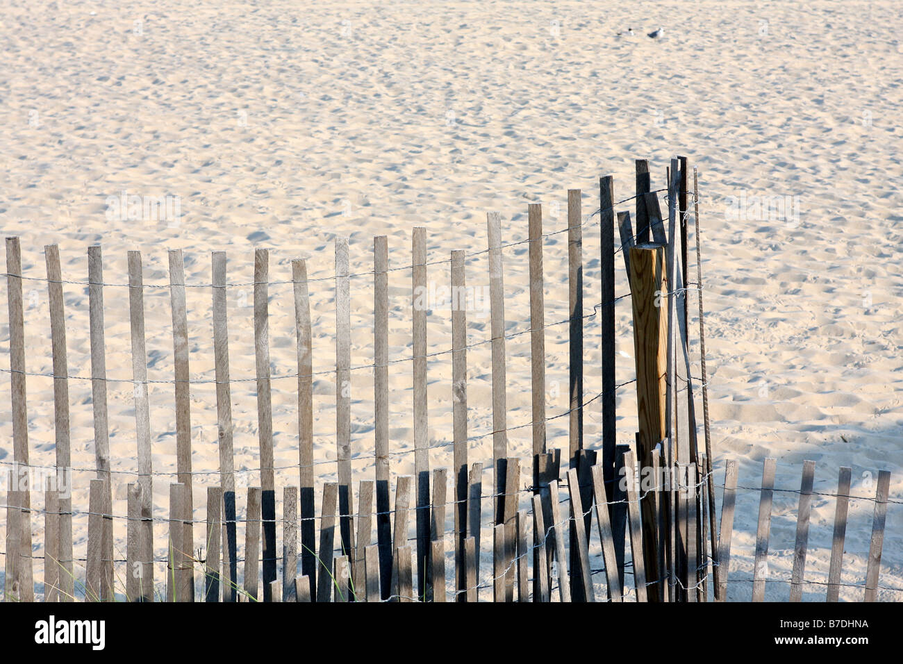 Photo of beach fence and sand hi-res stock photography and images - Alamy
