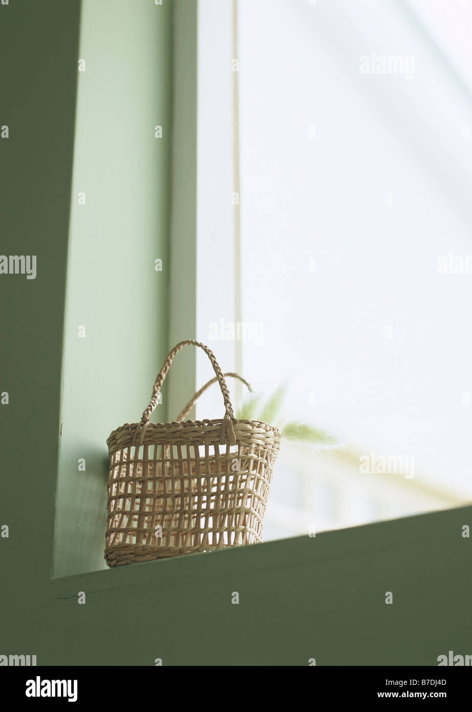 Basket by window Stock Photo - Alamy