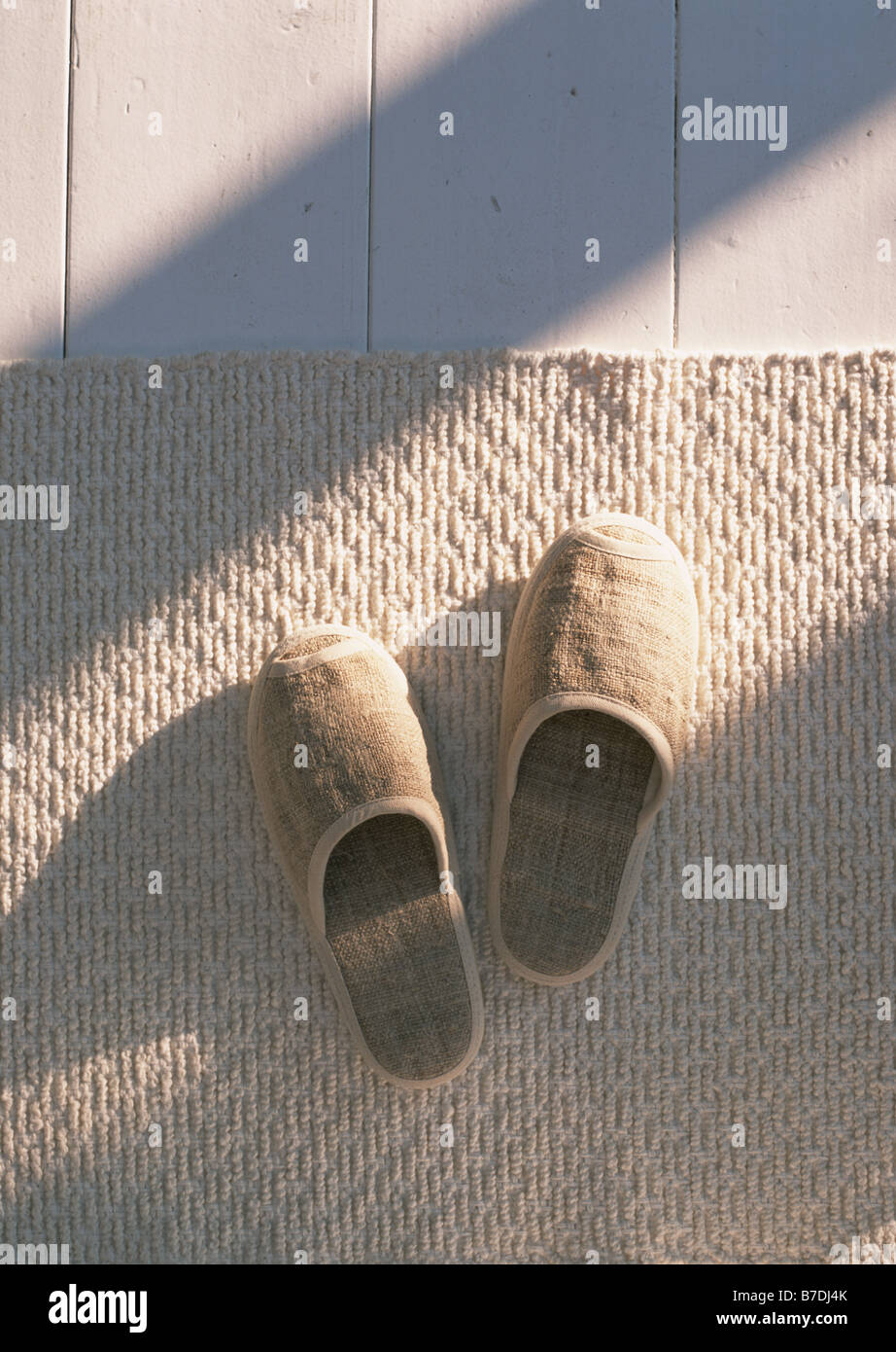 Slippers and rug Stock Photo - Alamy