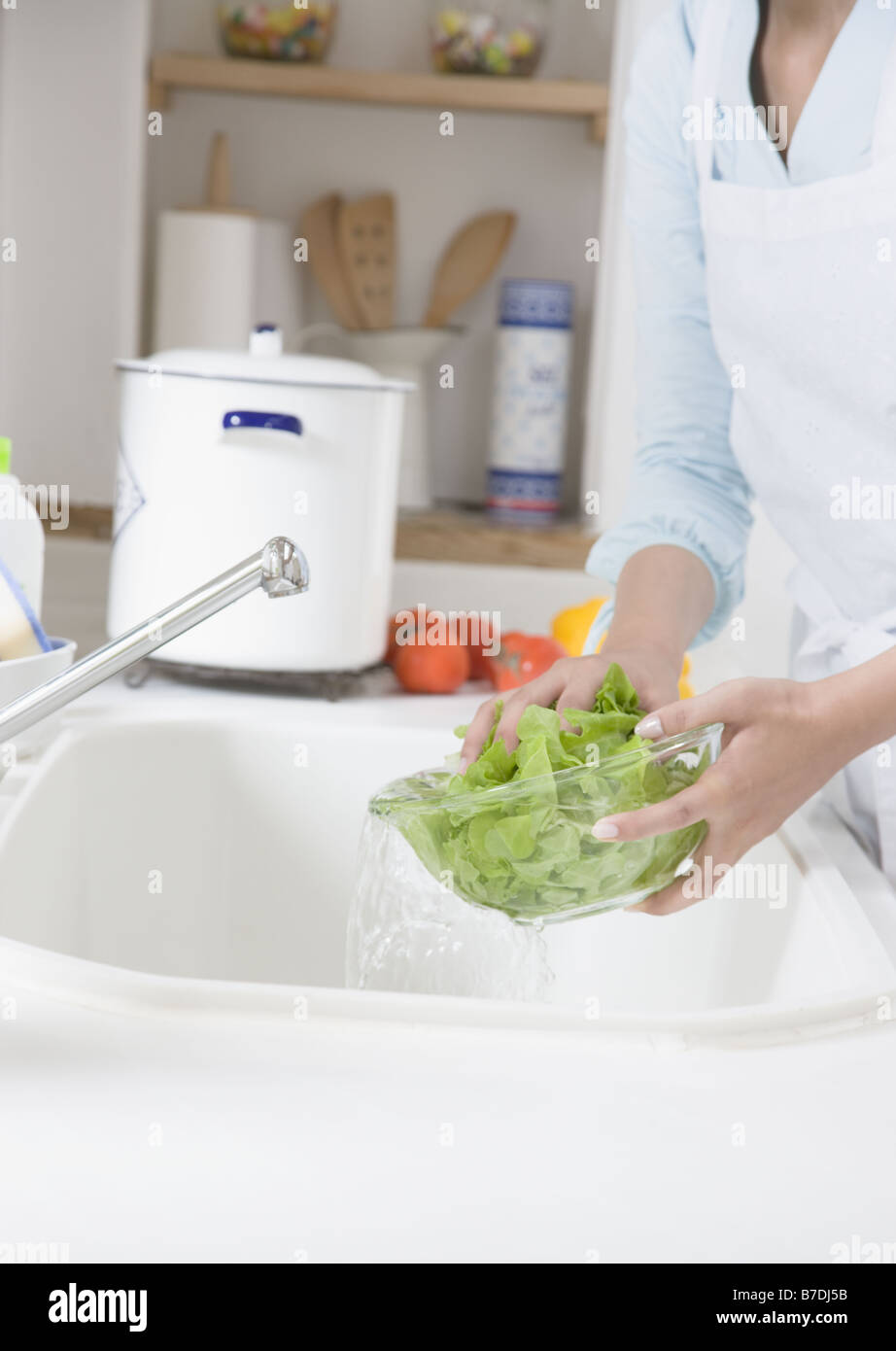 A woman washing vegetable Stock Photo - Alamy