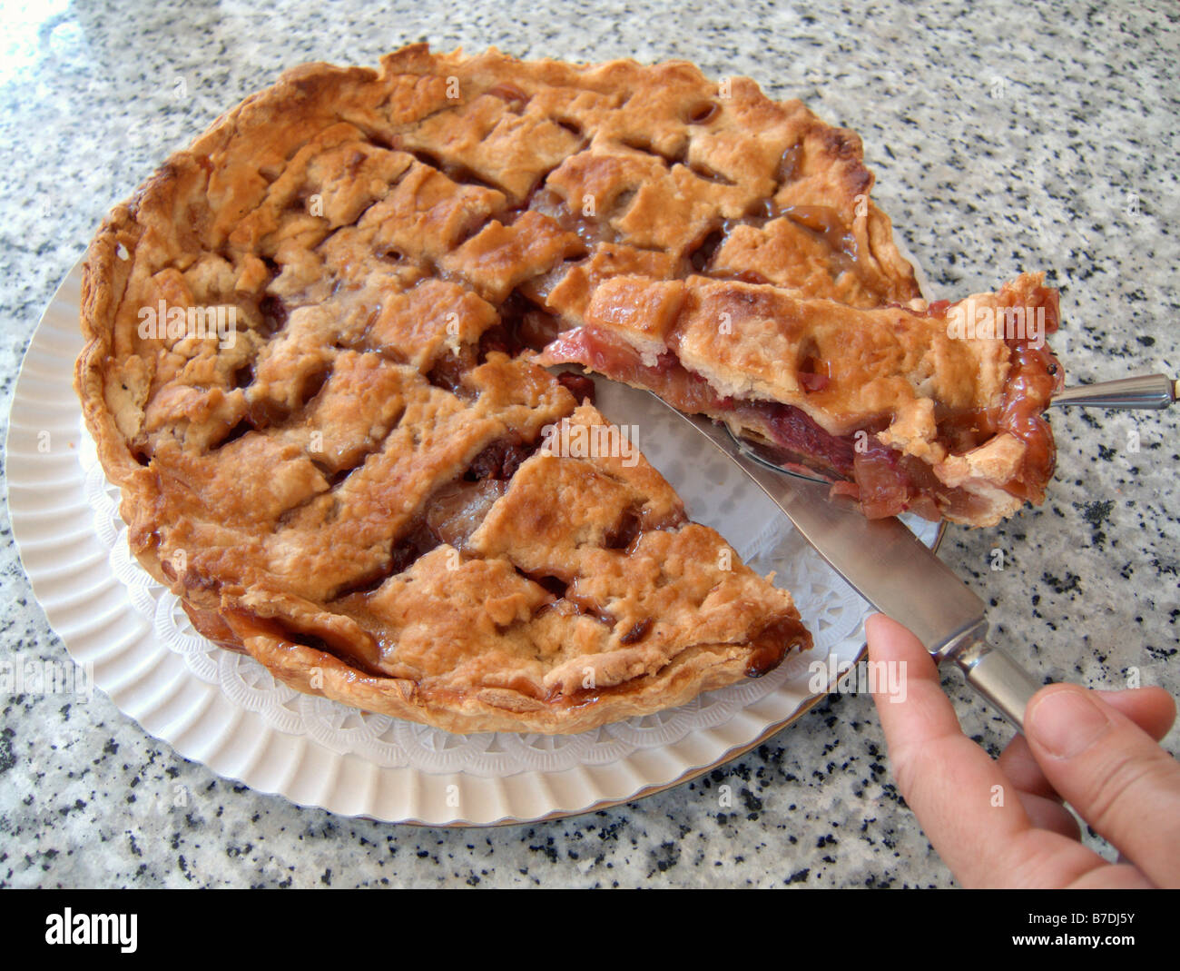 Cutting an apple pie slice Stock Photo - Alamy
