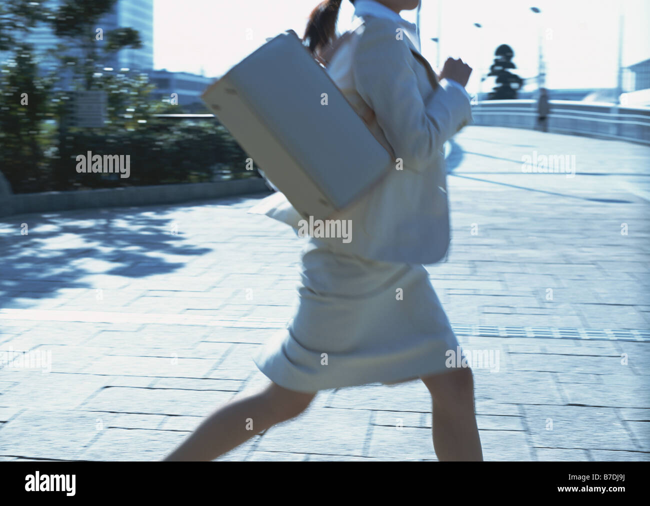 Business woman in a hurry Stock Photo - Alamy