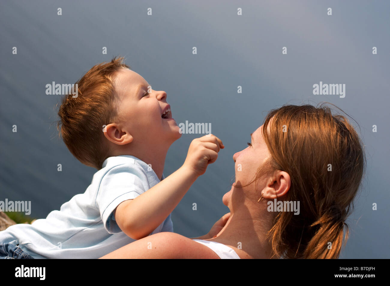 Young mother and son having fun together Stock Photo - Alamy
