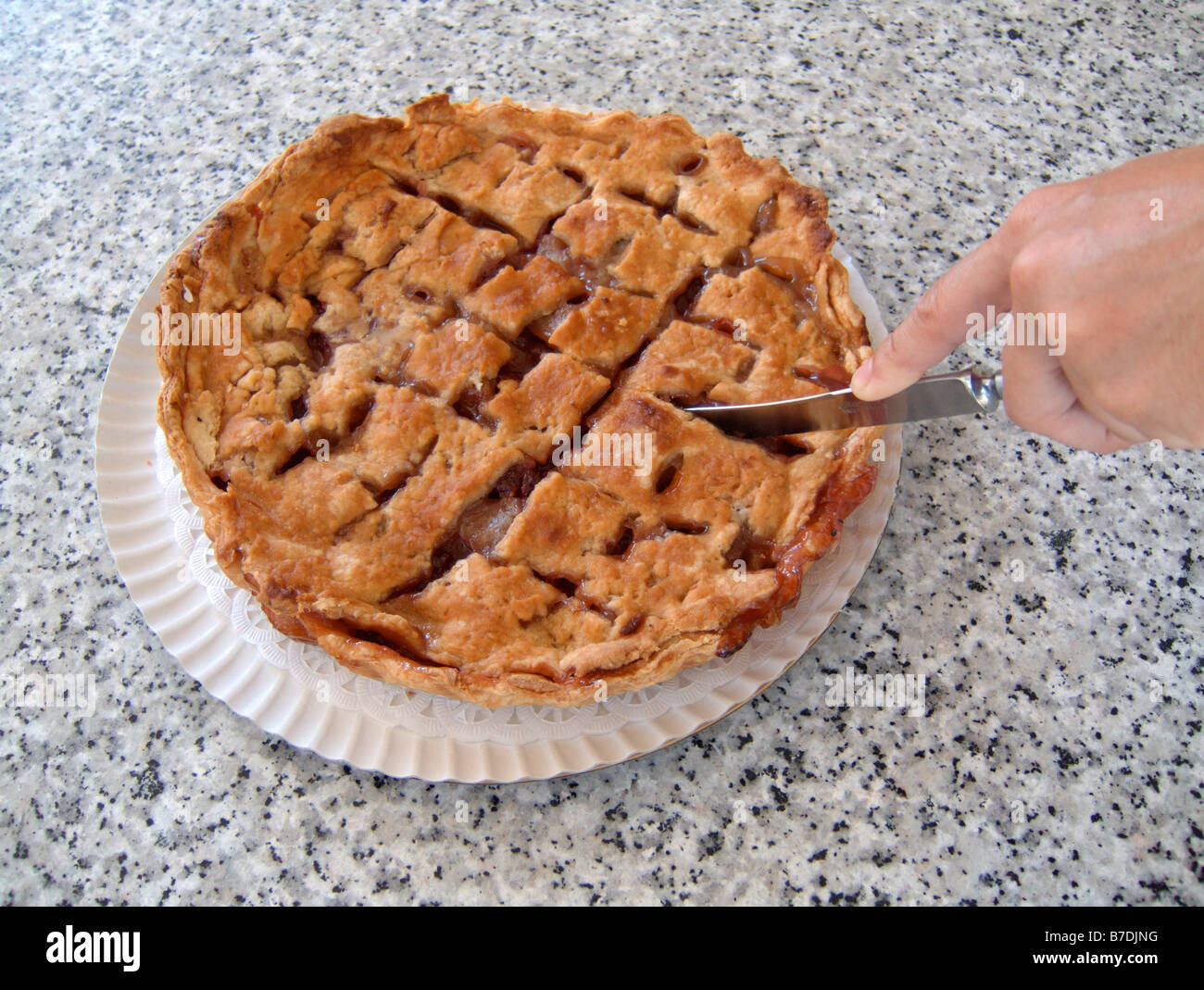Cutting an apple pie slice Stock Photo - Alamy