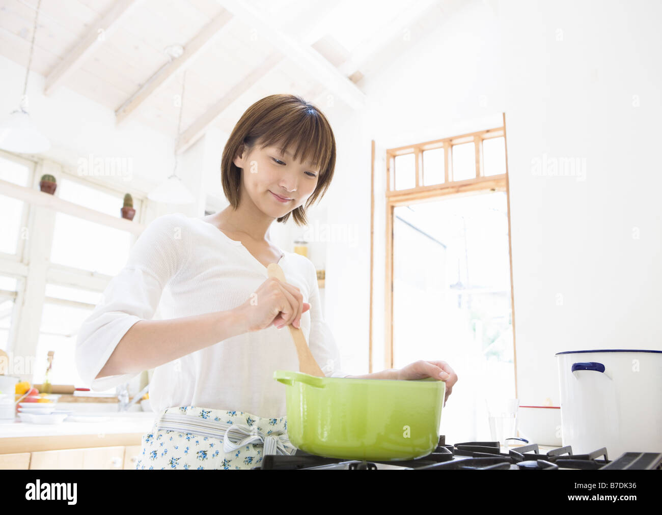 A woman cooking Stock Photo - Alamy