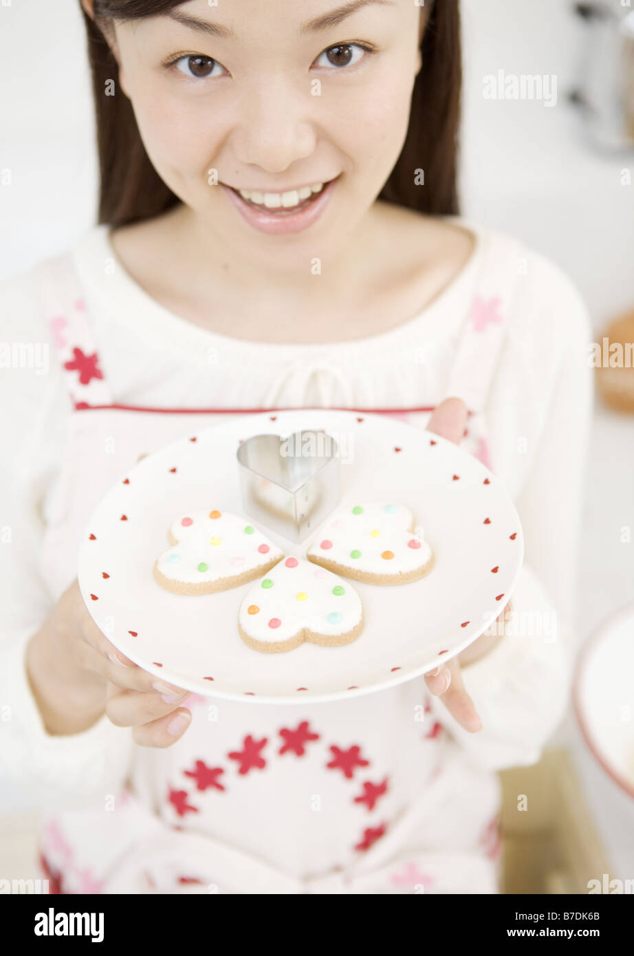 A woman holding cookies Stock Photo - Alamy