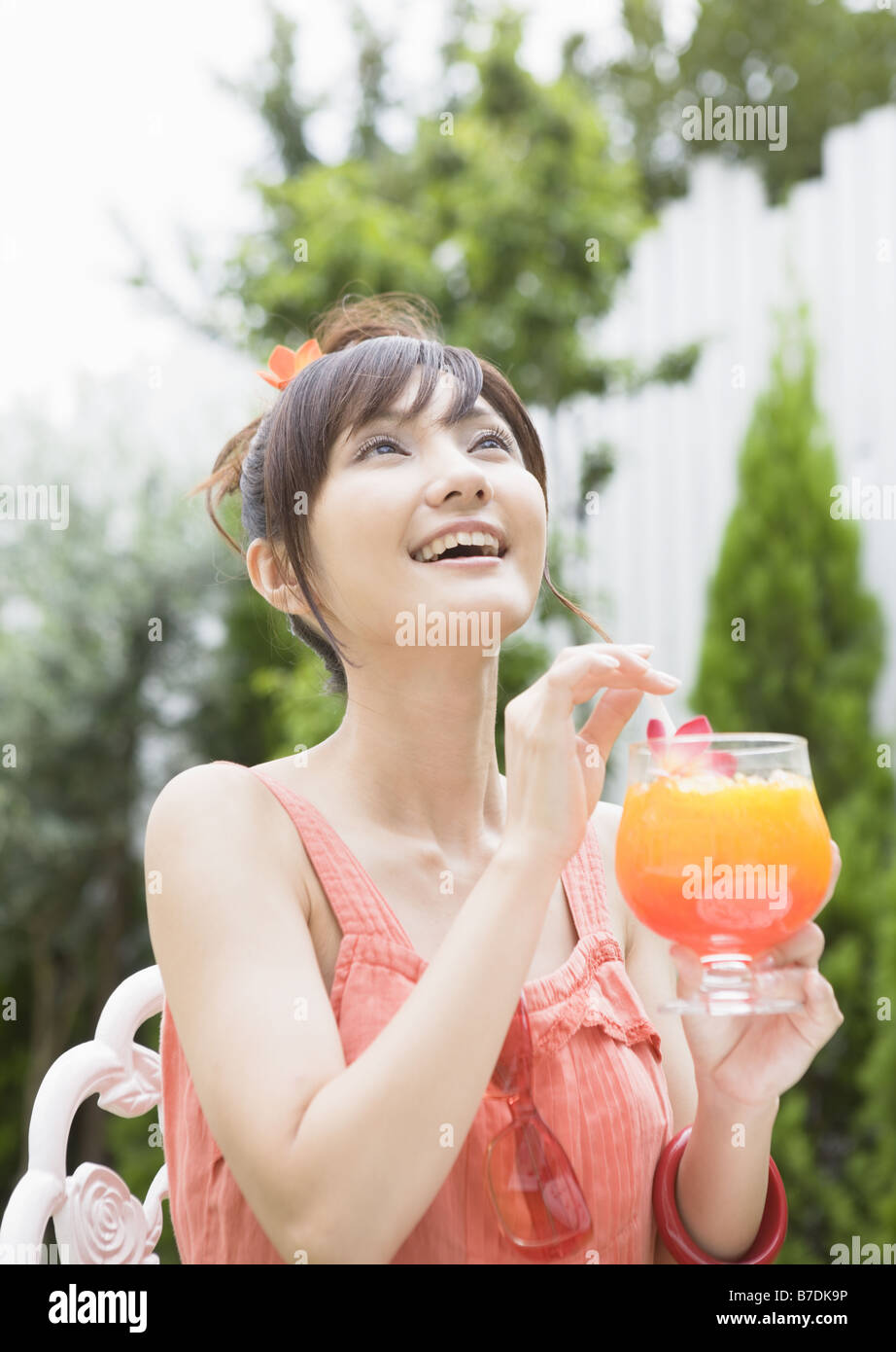 A woman drinking juice Stock Photo - Alamy