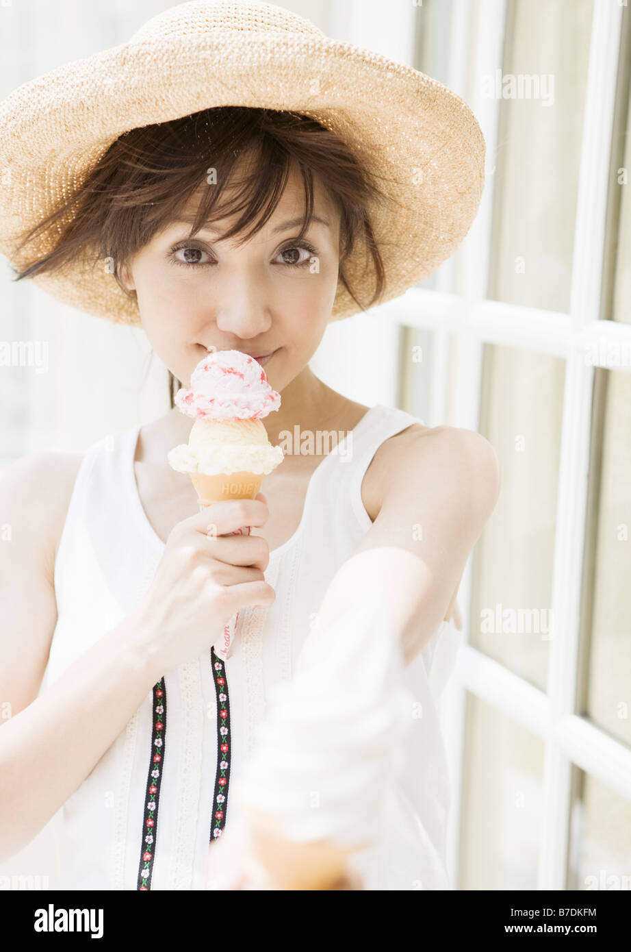 A woman giving ice cream Stock Photo - Alamy