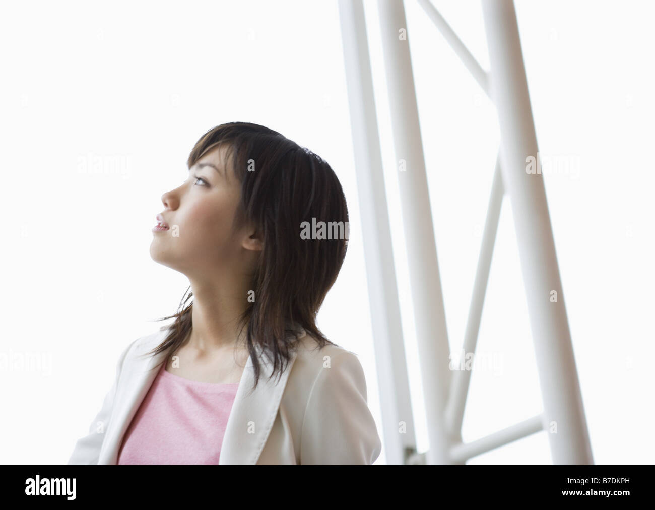 Young woman looking up Stock Photo - Alamy