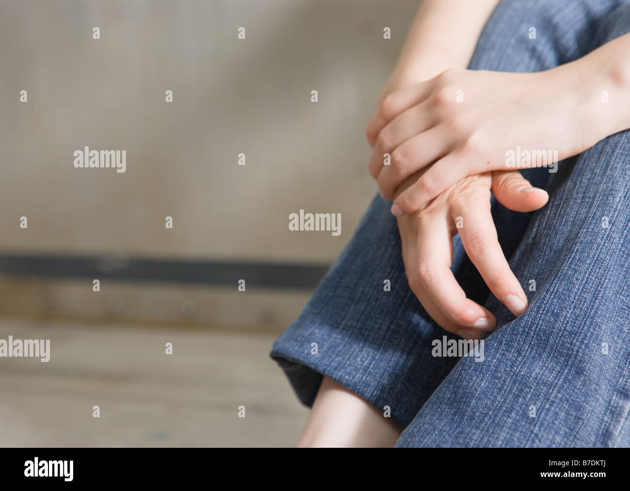Arms around knees hi-res stock photography and images - Alamy