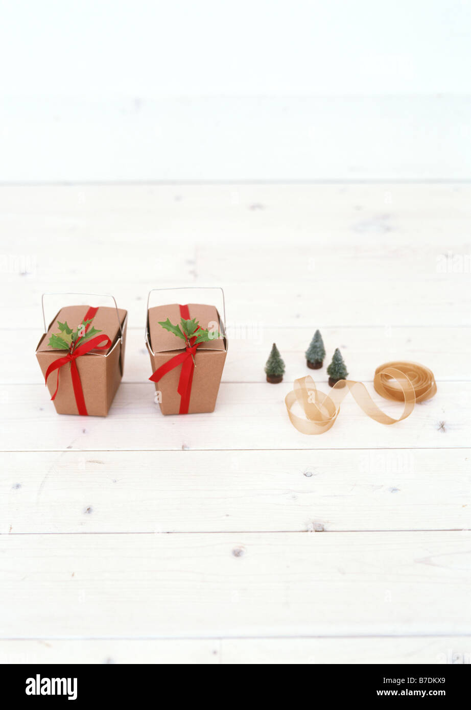 Tiny Christmas trees and gift boxes Stock Photo - Alamy