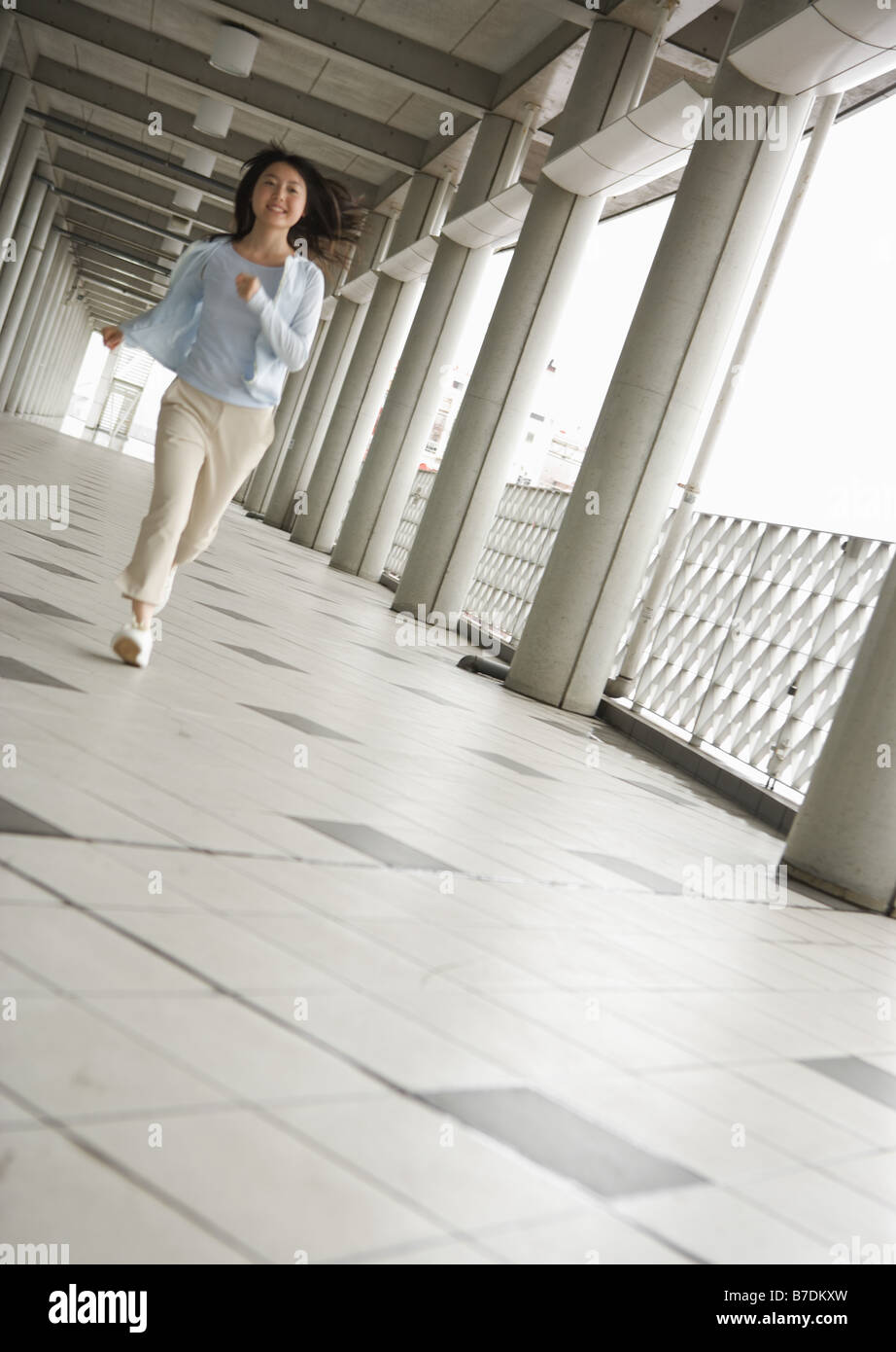 Woman in athletic gear running hi-res stock photography and images - Alamy