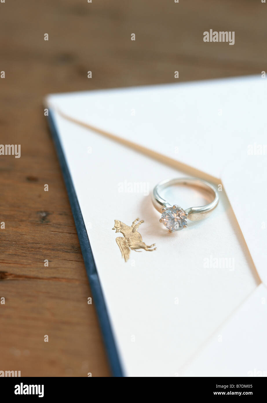 Diamond ring and envelope Stock Photo - Alamy