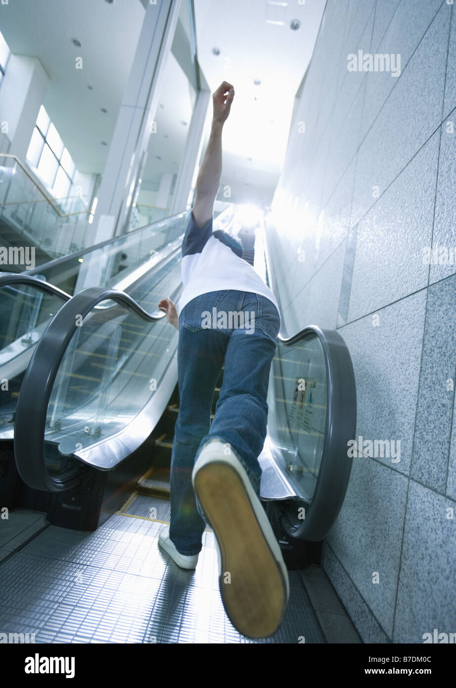 Young man running up escalator Stock Photo - Alamy Young man running up escalator Stock Photo - Alamy