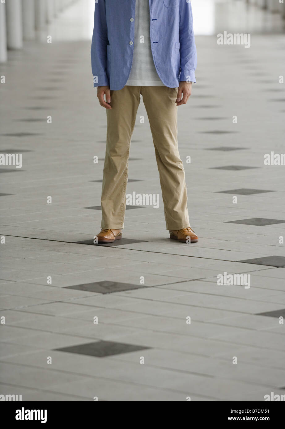 Standing young man Stock Photo - Alamy
