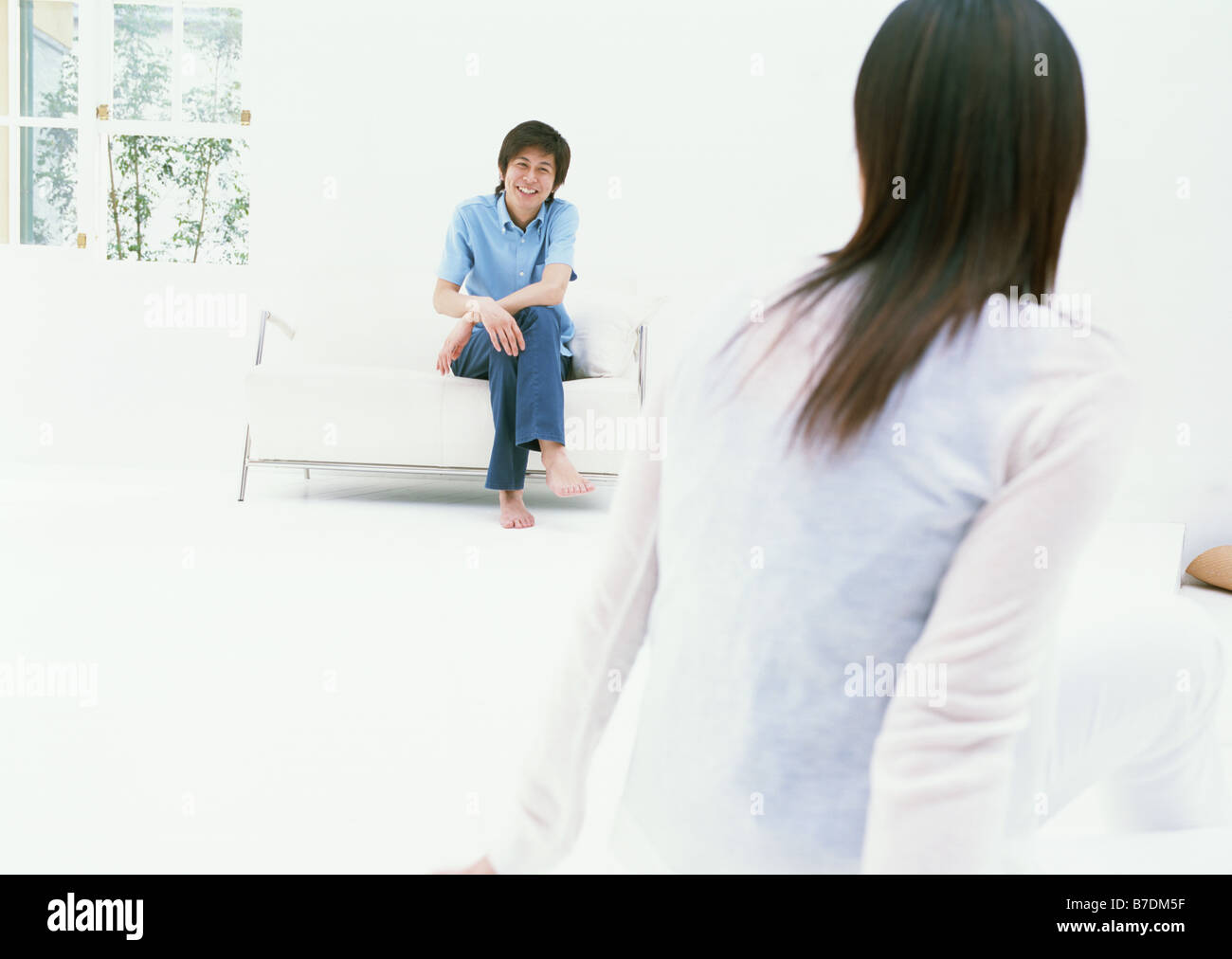 A couple talking in room Stock Photo - Alamy