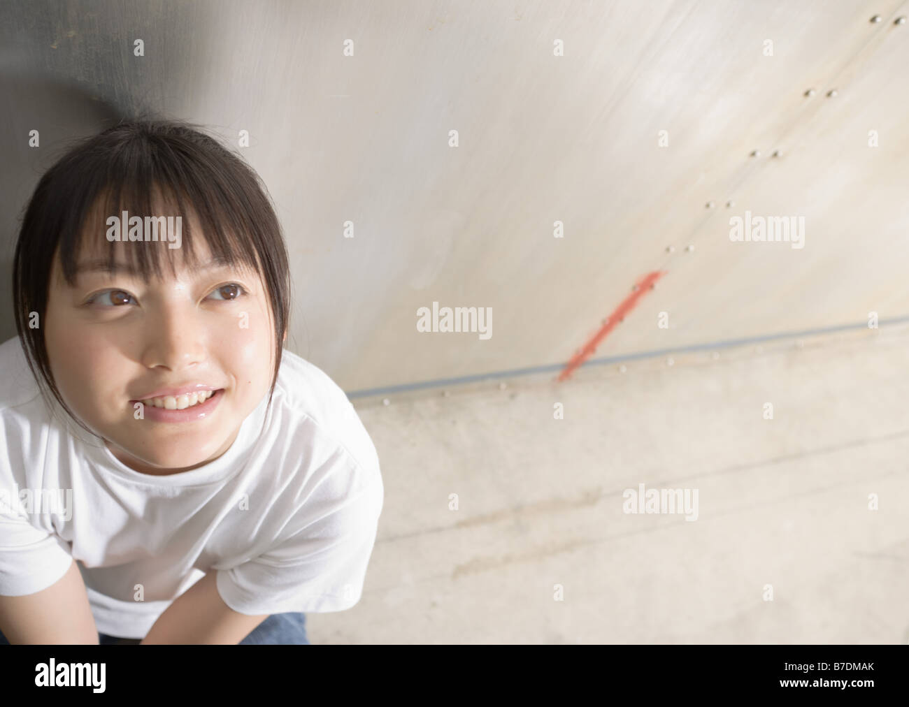 Young woman looking up Stock Photo - Alamy