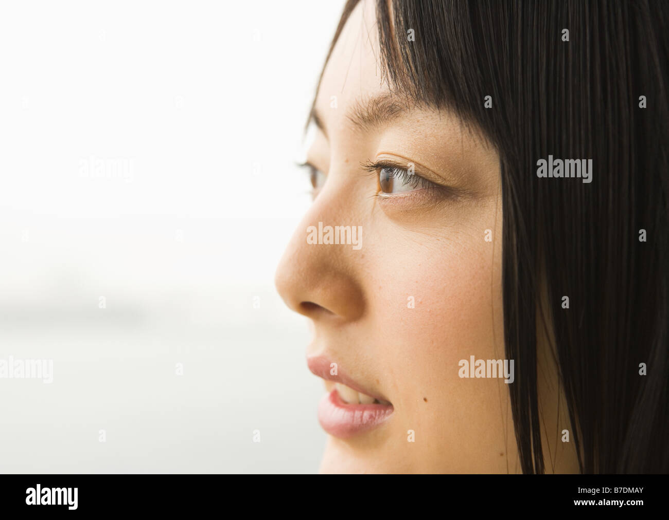 Side view of young woman Stock Photo - Alamy