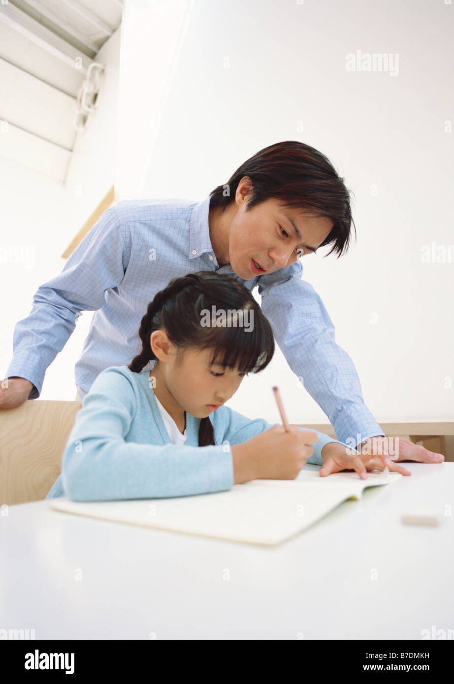 Girl desk writing profile hi-res stock photography and images - Alamy