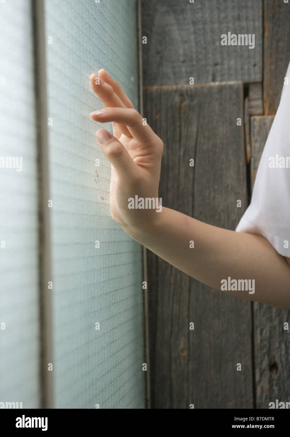 Hand on window Stock Photo - Alamy