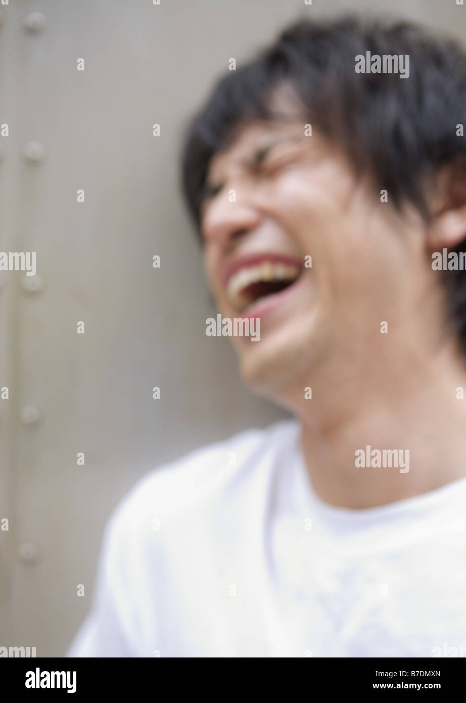 Laughing young man Stock Photo - Alamy